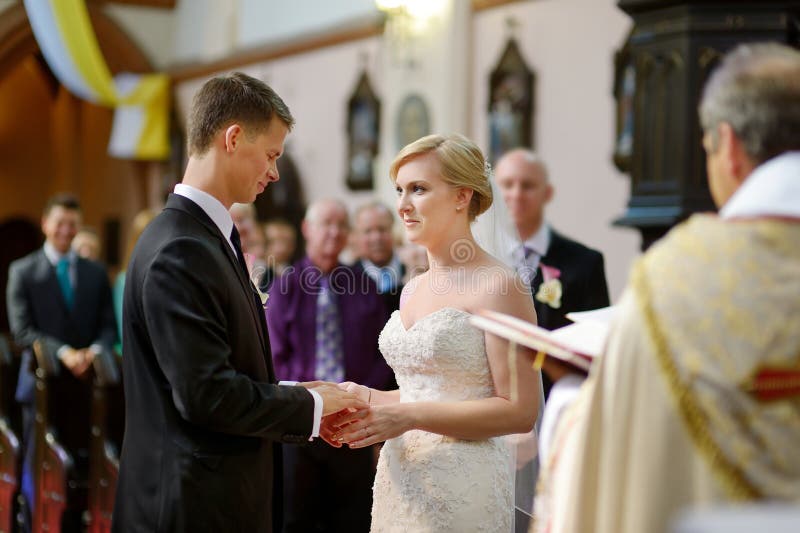 Bride and Groom at the Church Stock Image - Image of girl, bouquet ...