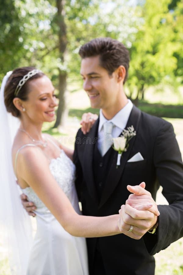 Bride and Groom Dancing while Holding Hands Stock Image - Image of ...