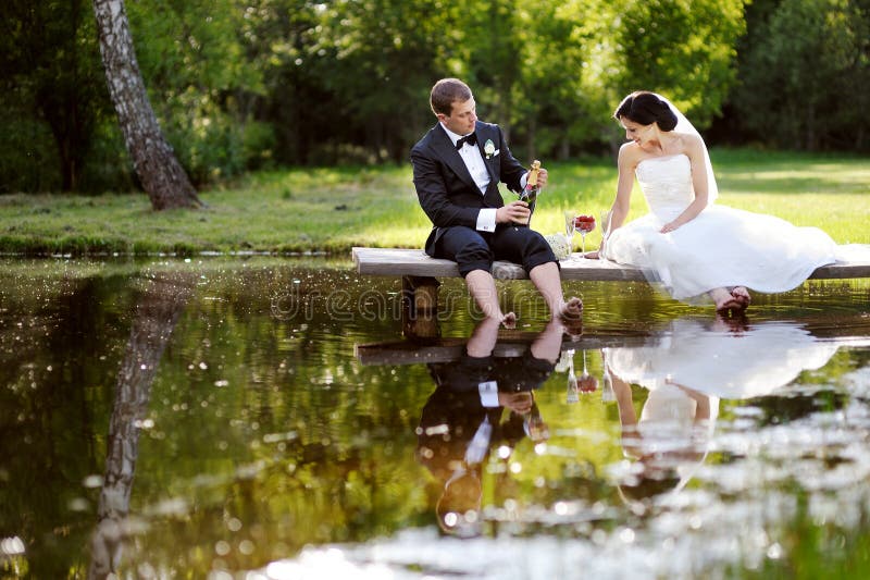 Bride and Groom Drinking Champagne Stock Image - Image of pool, bright ...