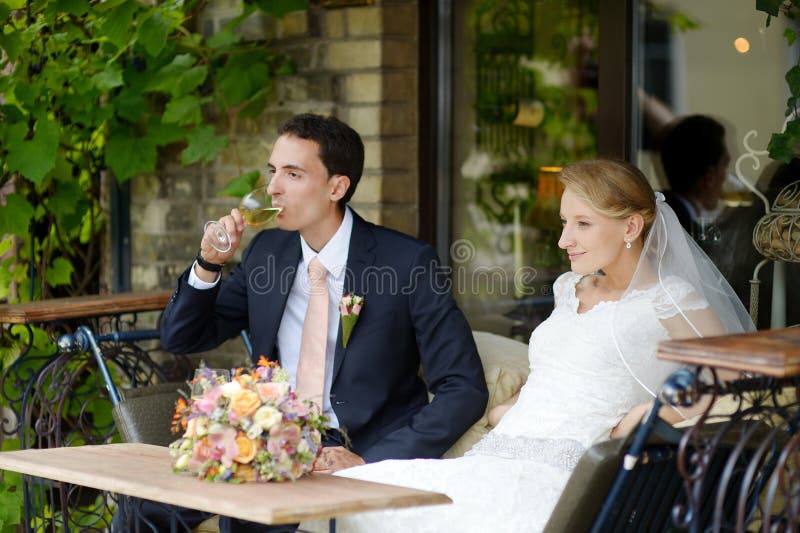 Bride and Groom Drinking Wine Stock Photo - Image of beverage, flowers ...
