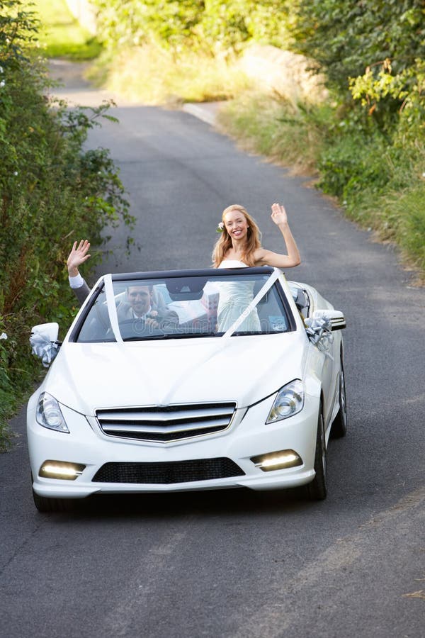 Bride and Groom Driving Away in Decorated Car Stock Image - Image of ...