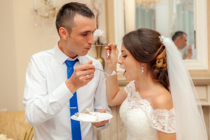 Bride and Groom Eat Wedding Cake Stock Image - Image of married, male ...