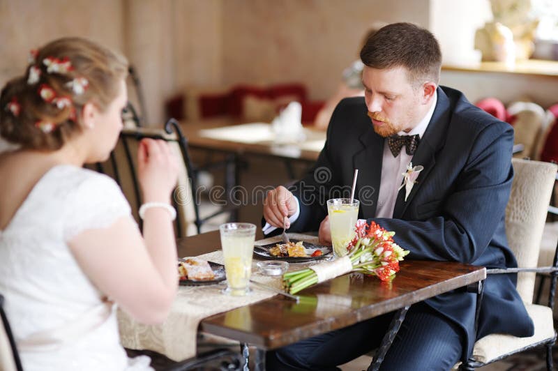 Bride and Groom Eating a Dessert Stock Image - Image of away, dining ...
