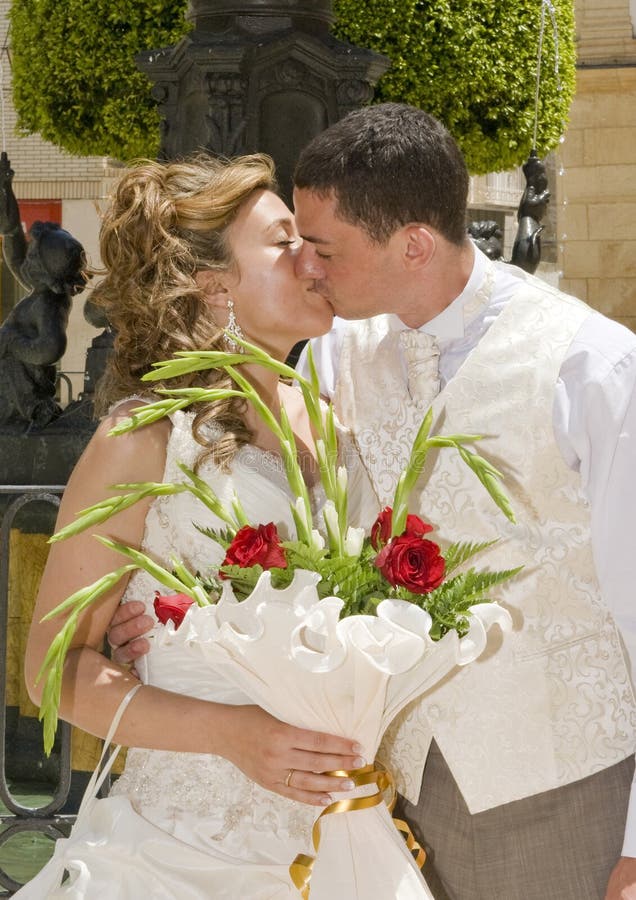 Kiss of bride and groom stock image. Image of kissing - 5671137
