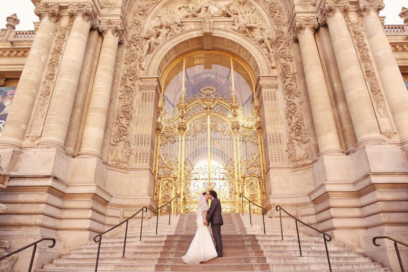 Bride and Groom in Front of a Big Building Stock Photo - Image of black ...