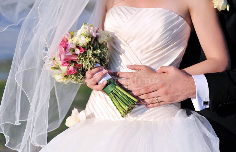 Bride and groom hands stock image. Image of bouquet, fingers - 25479607