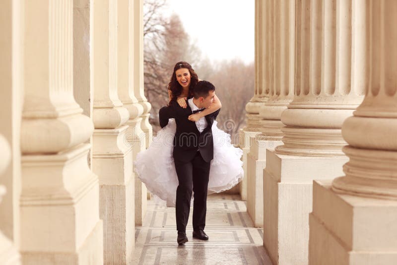 Bride and groom having fun stock photo. Image of affection - 58069784