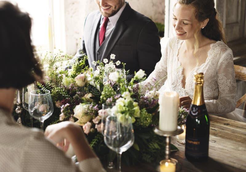Bride and Groom Having Meal with Friends at Wedding Reception Stock ...