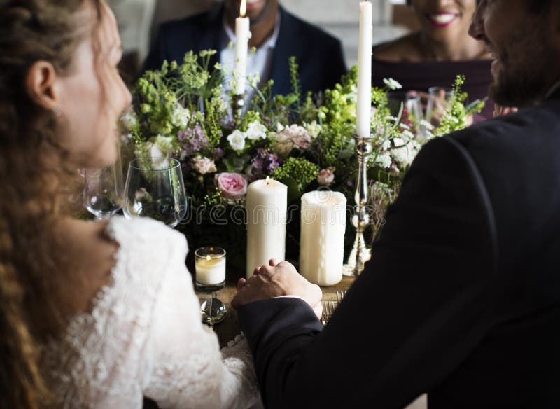 Bride and Groom Holding Hands Each Other on Wedding Reception Stock ...