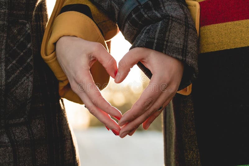Bride and Groom Holding Hands in Shape of Heart Stock Image - Image of ...