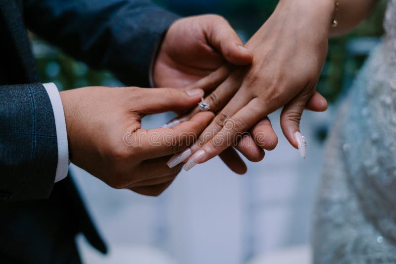 The Bride and Groom Holding Jewelry Together Stock Photo - Image of ...