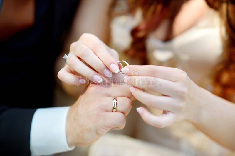 Hand of the Groom and the Bride with Wedding Rings Stock Photo - Image ...