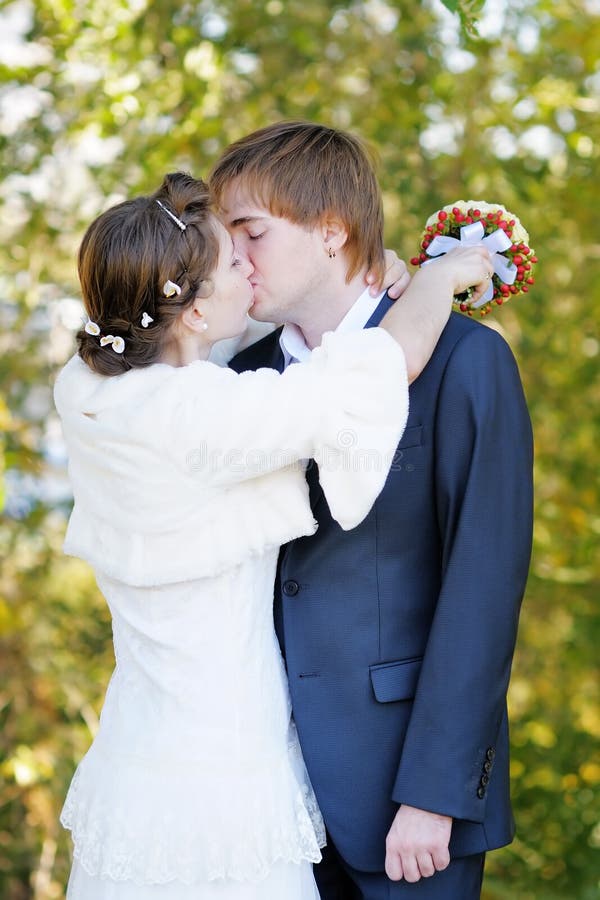 Bride and groom kissing stock photo. Image of elegance - 27707116
