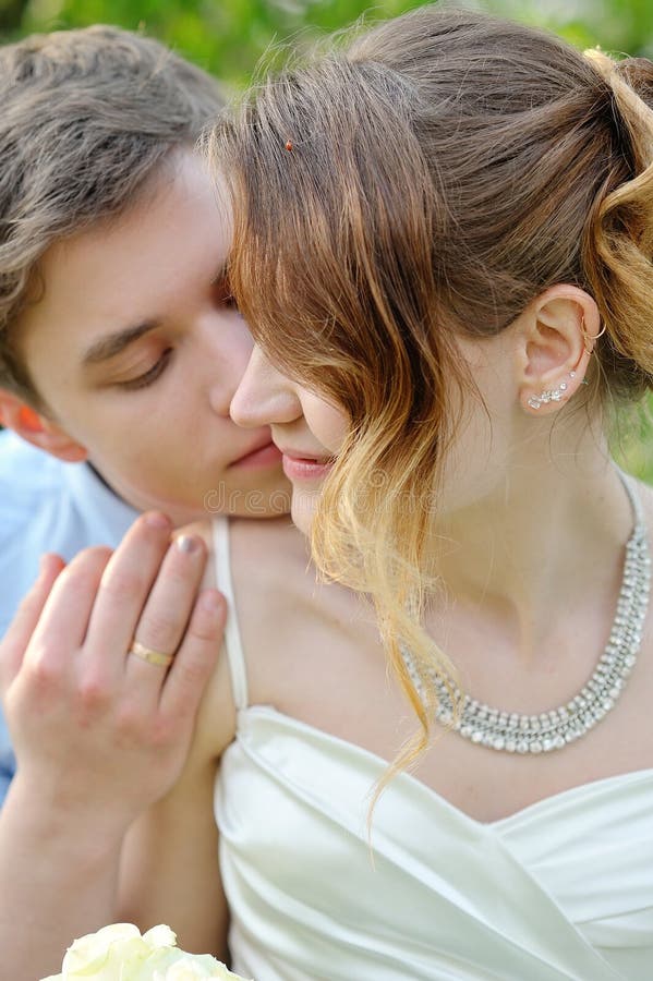Bride and Groom Kissing in the Spring Garden Stock Image - Image of ...
