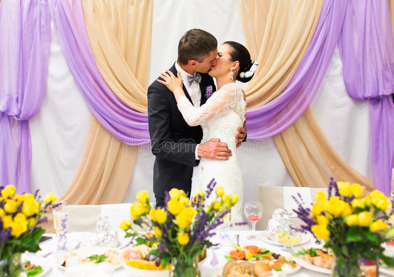 Bride and Groom Kissing at Wedding Reception Stock Image - Image of ...