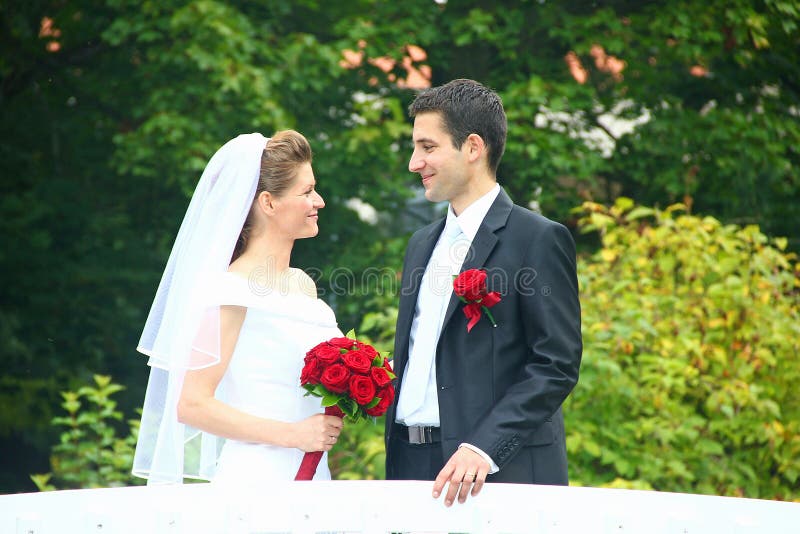 Bride and Groom Looking at Each Other Stock Photo - Image of bouquet ...