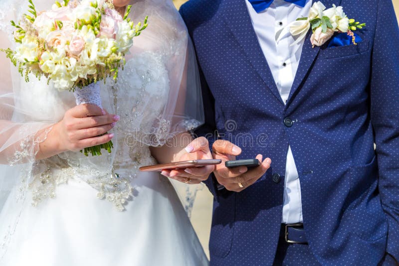 The Bride and Groom with Mobile in Hand. Modern Wedding with Gadgets ...