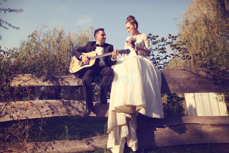 Bride and Groom Playing at Guitar Stock Photo - Image of lifestyle ...