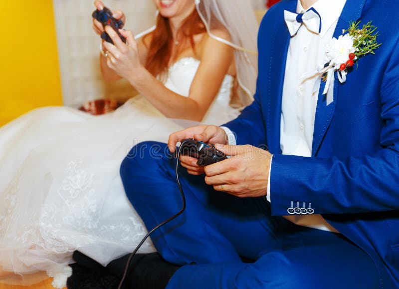 Bride and Groom Playing Together Videogames with Joysticks - Gaming and ...