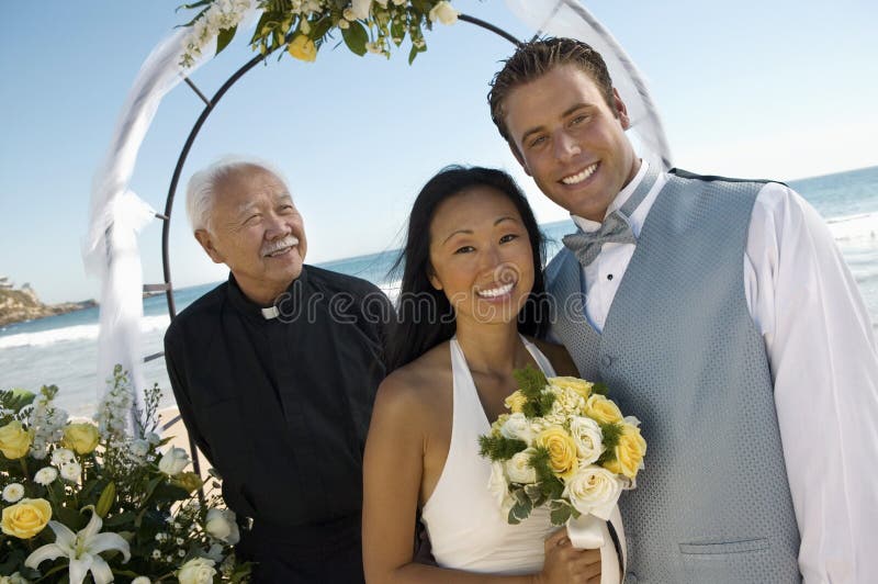 Bride and Groom with Priest Under Archway Stock Image - Image of ...