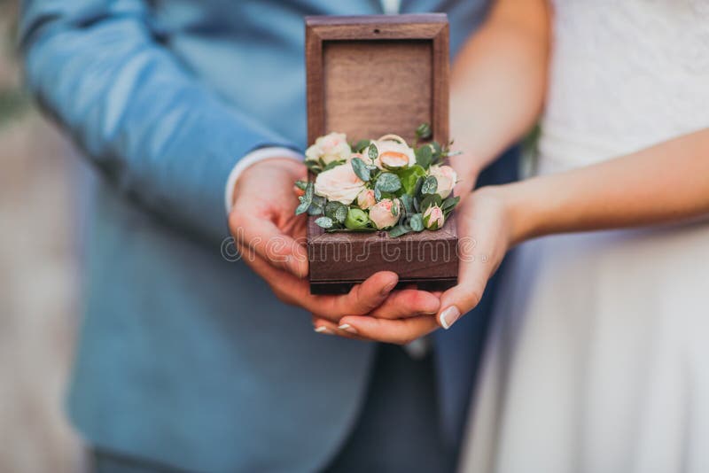 Bride and Groom Hold Casket with Flowers Stock Photo - Image of husband ...