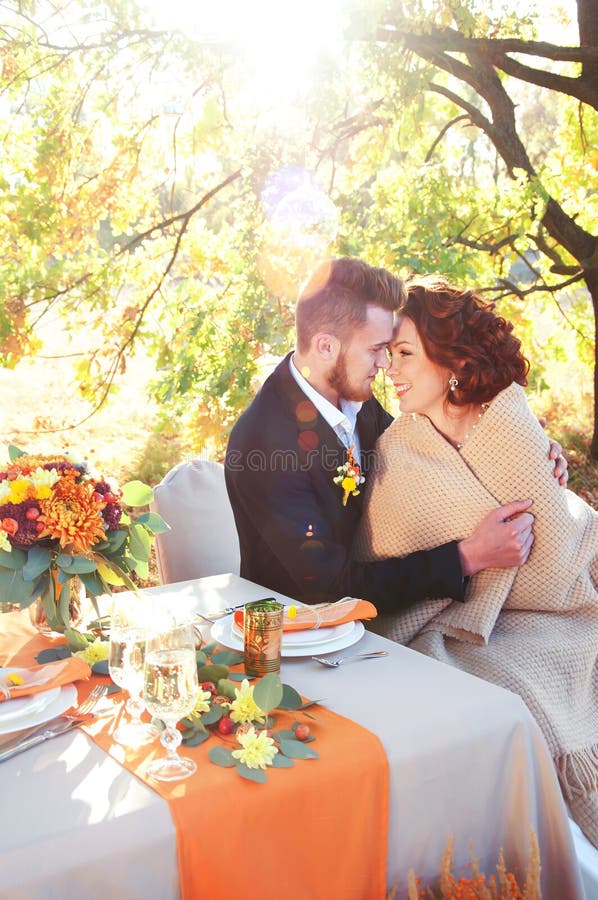Bride and Groom at the Wedding Table. Autumn Outdoor Setting Stock ...
