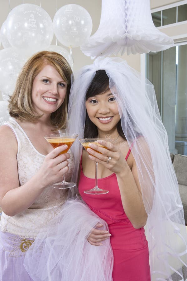 The Bride and Her Friend are Holding Wedding Bouquets of White Roses ...