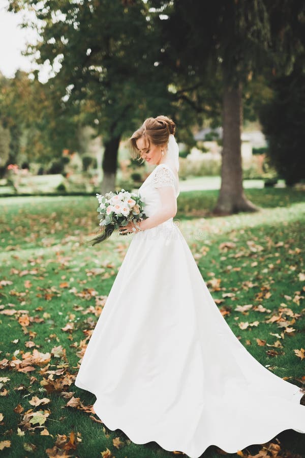 Bride Holding Big and Beautiful Wedding Bouquet with Flowers Stock ...