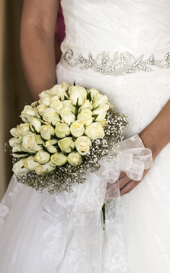 Bride holding her flower stock image. Image of color - 33536479