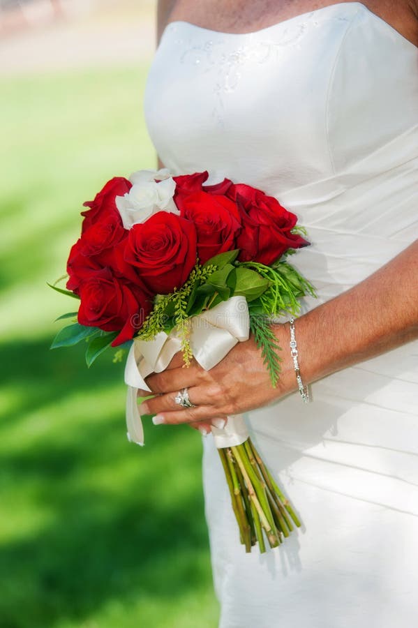 Bride Holding Red Rose Bouquet Stock Image - Image of close, romance ...