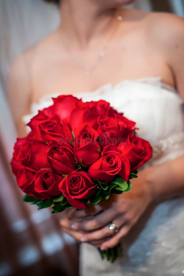Bride Holding Red Rose Bouquet Stock Photo - Image of beautiful, fresh ...