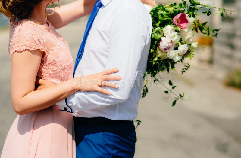 The Bride is Hugging the Groom Stock Image - Image of girl, bouquet ...