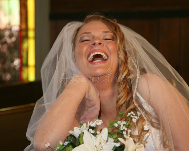 Bride laughing in church stock image. Image of shoulder - 12845573