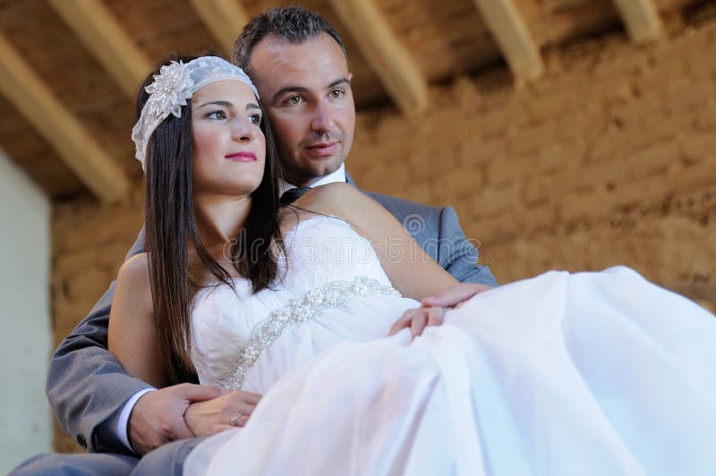 Bride Leaning on Groom in a Warehouse in Ruins Stock Photo - Image of ...