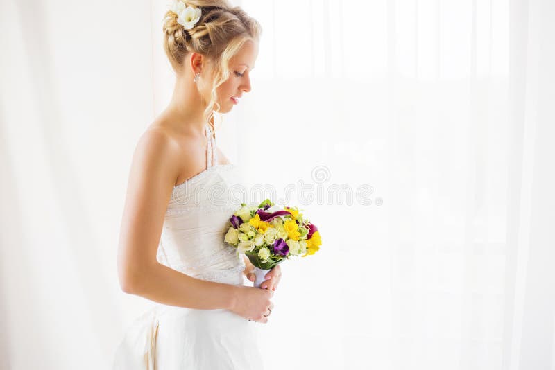 Bride Looking Down at Her Wedding Flowers Stock Image - Image of hand ...