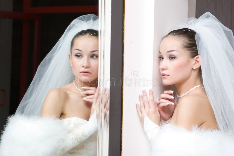 Bride by the mirror stock image. Image of portrait, face - 4345953