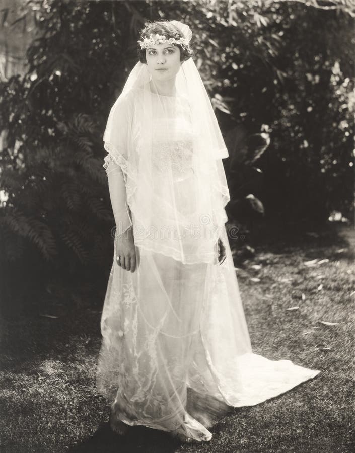 Bride posing in back yard stock image. Image of hair - 77560759