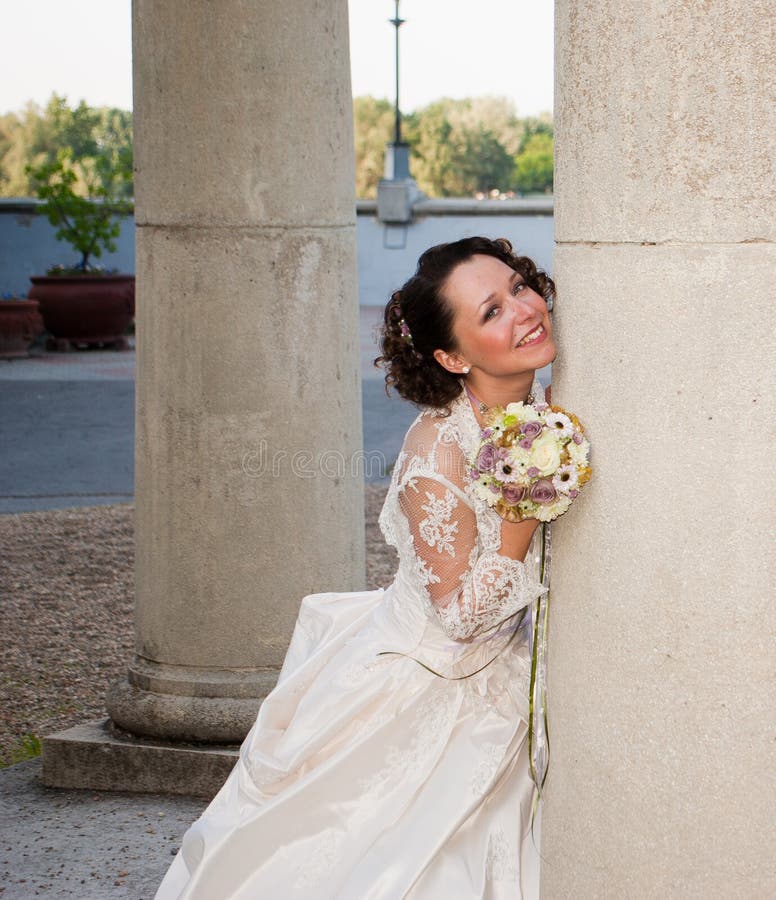Bride posing at column stock photo. Image of clothes - 22336664