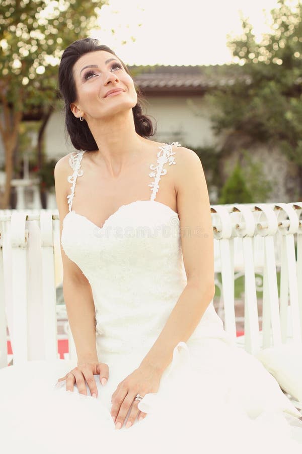 Bride Posing in the Garden on Her Wedding Day Stock Photo - Image of ...