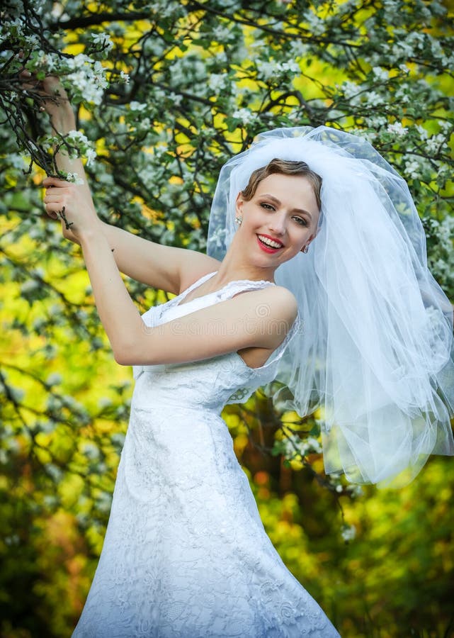 Bride Posing in Her Wedding Day Stock Image - Image of gown, outdoors ...