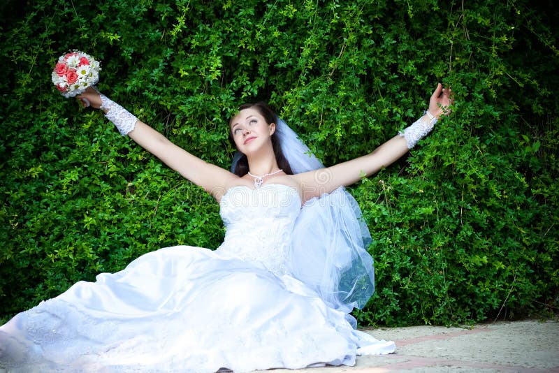 Bride is Resting with Outstretched Arms Stock Photo - Image of green ...