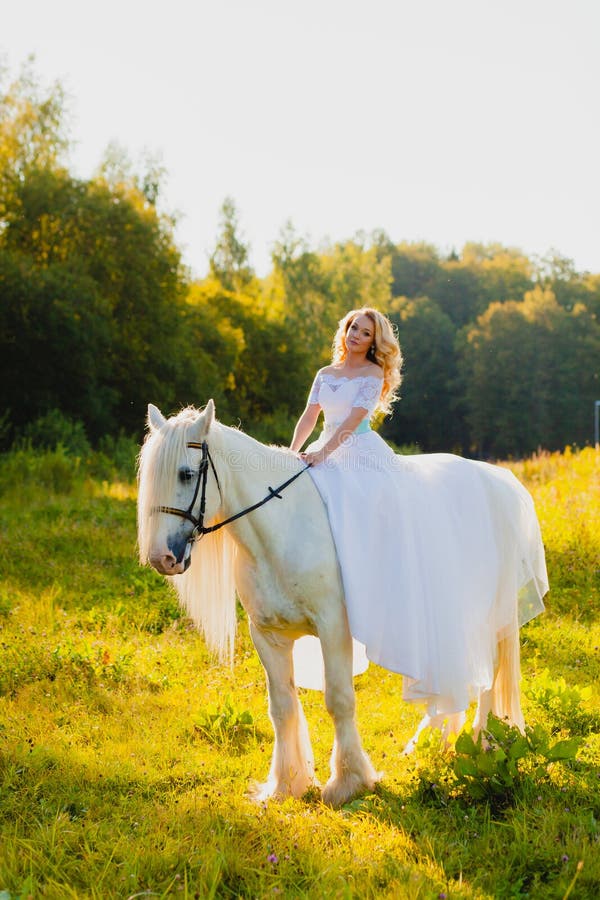 Bride Riding a Horse on the Background of Sunset Stock Image - Image of ...