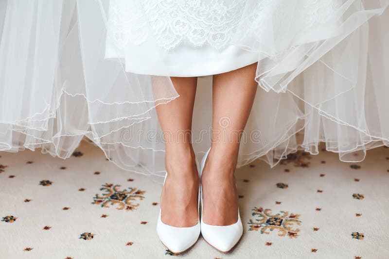 Bride`s Feet in Shoes Under Wedding Dress. Stock Photo - Image of foot ...