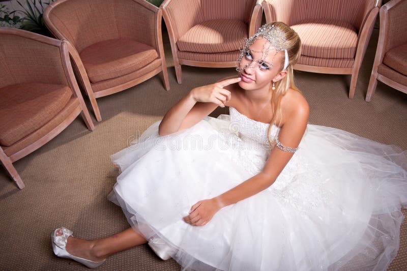 Bride seated on the floor stock photo. Image of female - 23602594