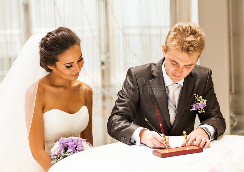 Bride Signing Marriage License or Wedding Contract Stock Photo - Image ...
