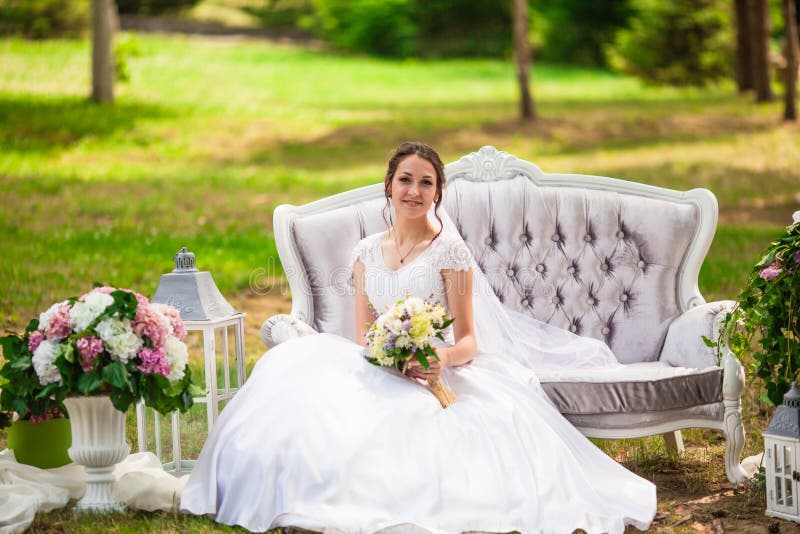 Bride Sitting at the Sofa in the Decorated Corner Stock Image - Image ...