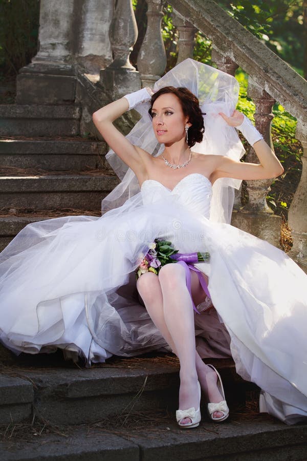 Bride and Groom Sitting on the Stairs Stock Photo - Image of caucasian ...