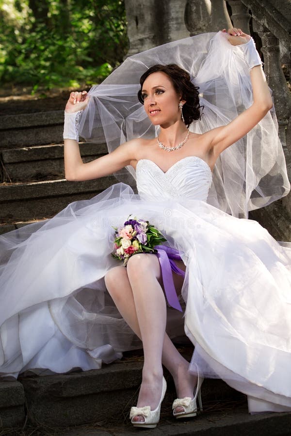 Bride and Groom Sitting on the Stairs Stock Photo - Image of caucasian ...