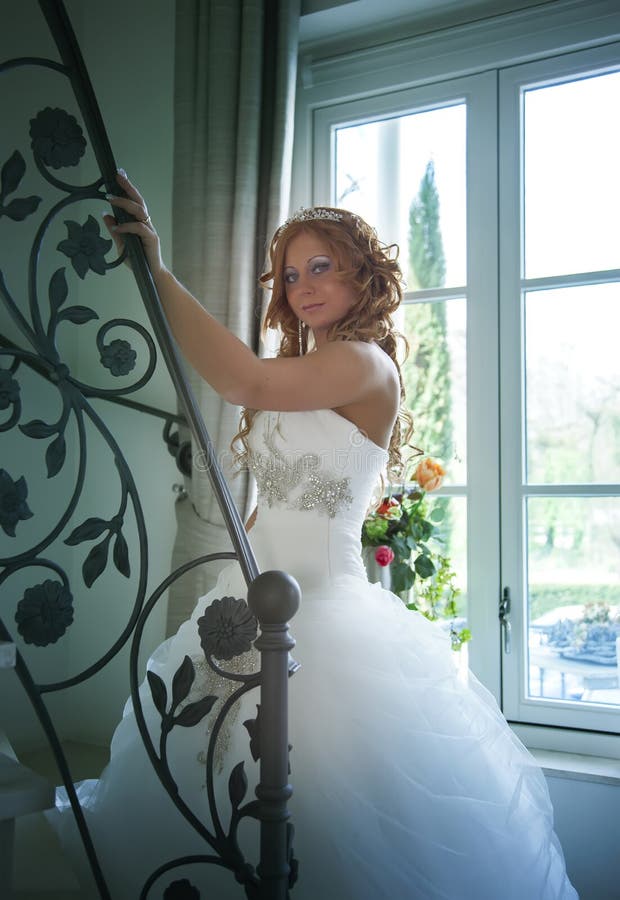 Bride on stair in house stock image. Image of elegant - 31186137
