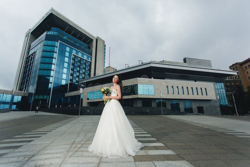 Bride Standing in Front of the High Building Stock Photo - Image of ...